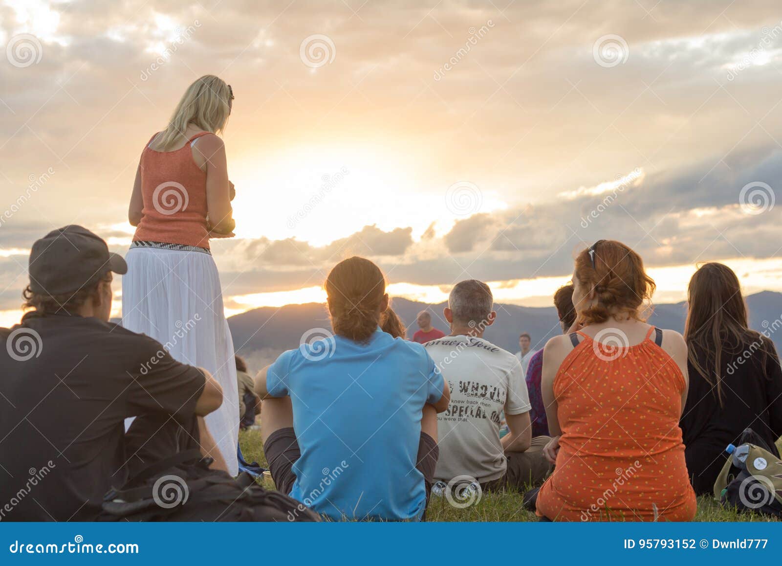Group of People Sitting on Grass and Enjoy Sunset Editorial Photography ...