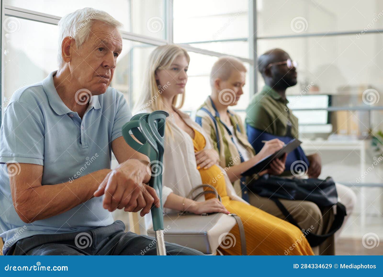 Group of People Sitting in a Queue in Social Service Stock Image ...