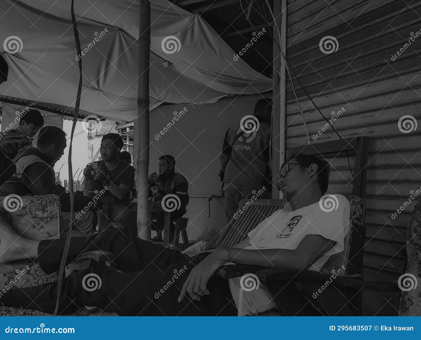 A Group of People Sitting in a Stall Editorial Photography - Image of ...