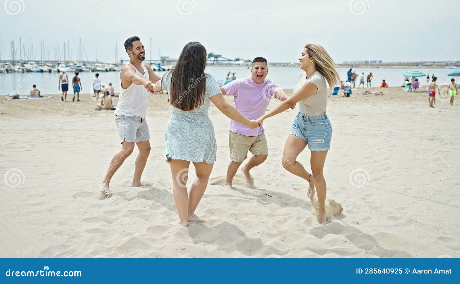 Group of People Smiling Confident Dancing with Hands Together at Beach ...
