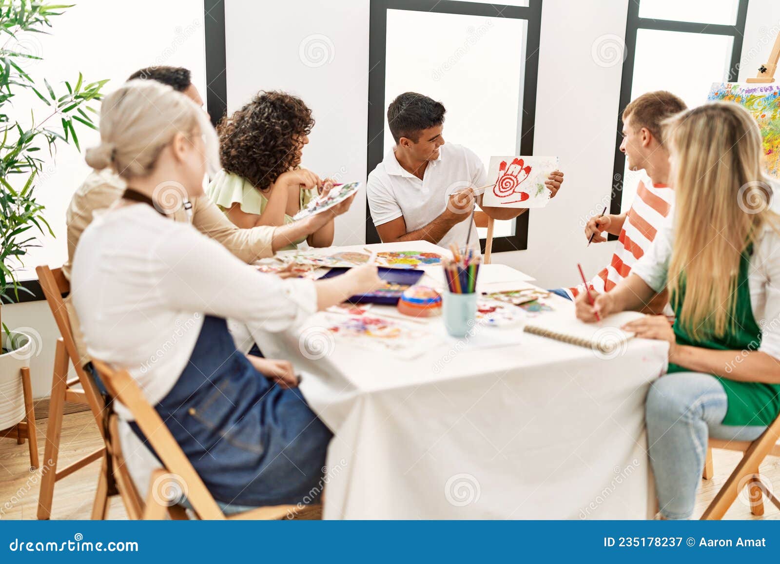 Group of People Smiling Happy Drawing Sitting on the Table at Art ...