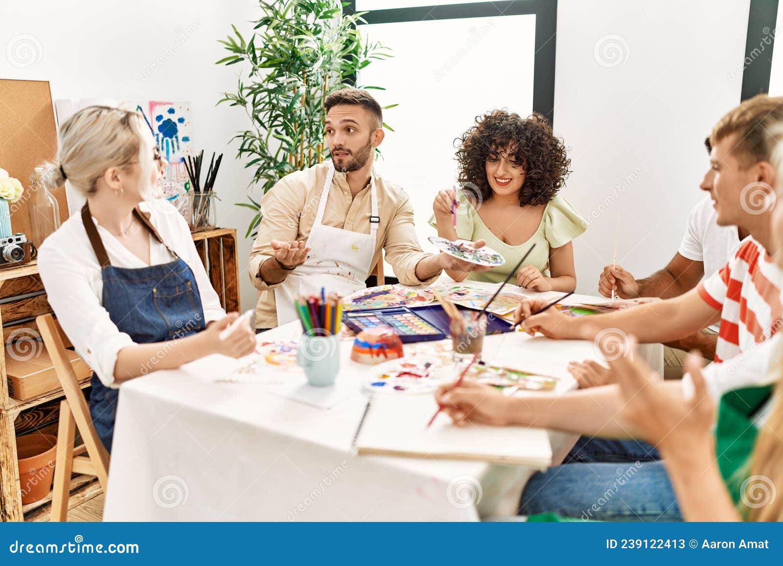 Group of People Smiling Happy Drawing Sitting on the Table at Art ...