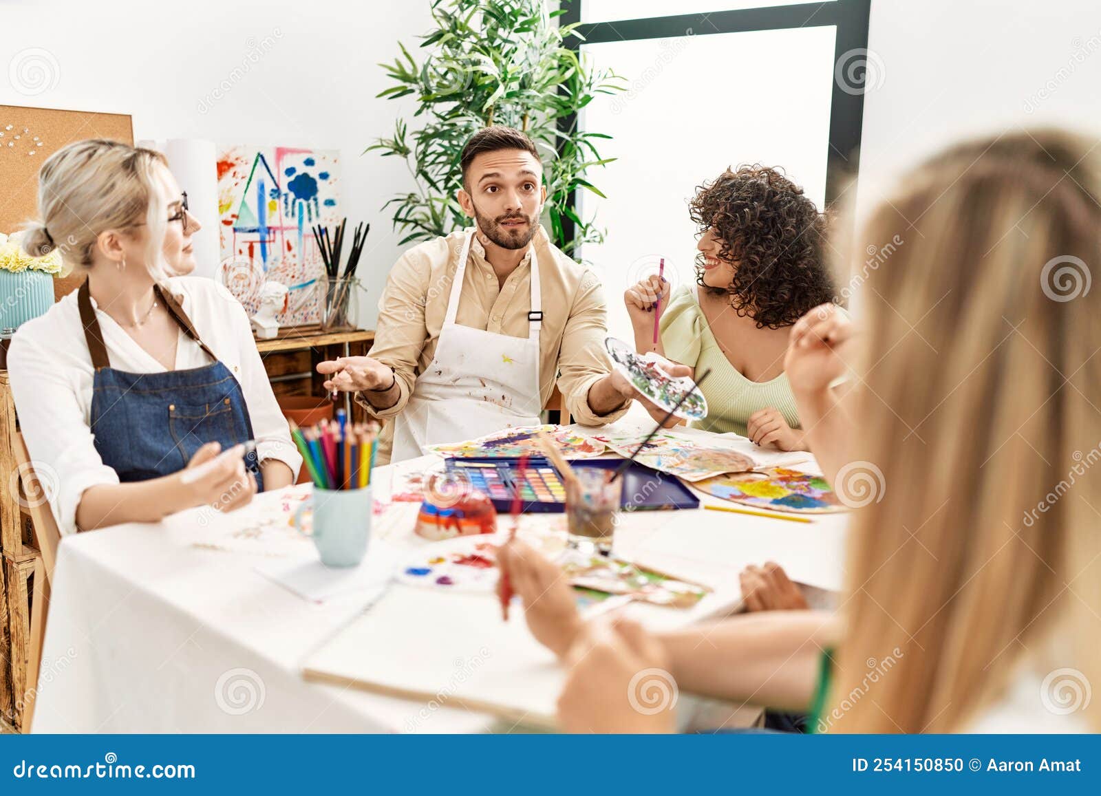 Group of People Smiling Happy Drawing Sitting on the Table at Art ...
