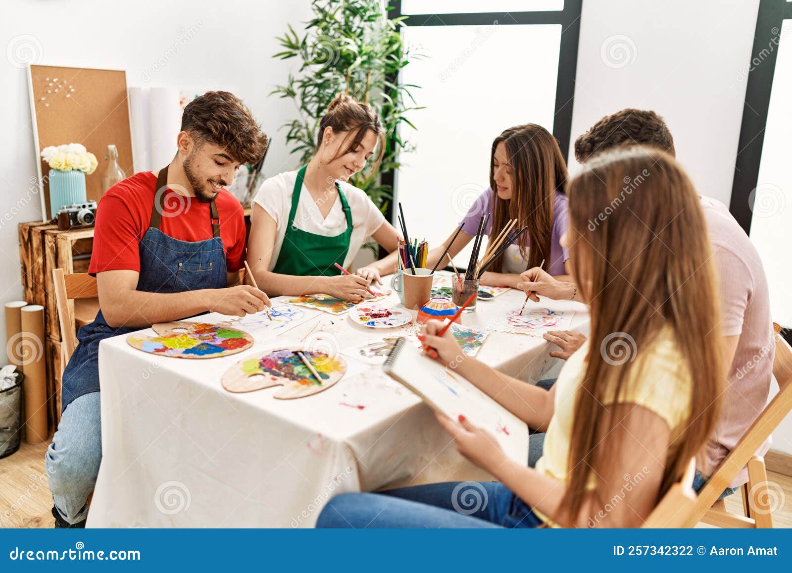 Group of People Smiling Happy Drawing Sitting on the Table at Art ...
