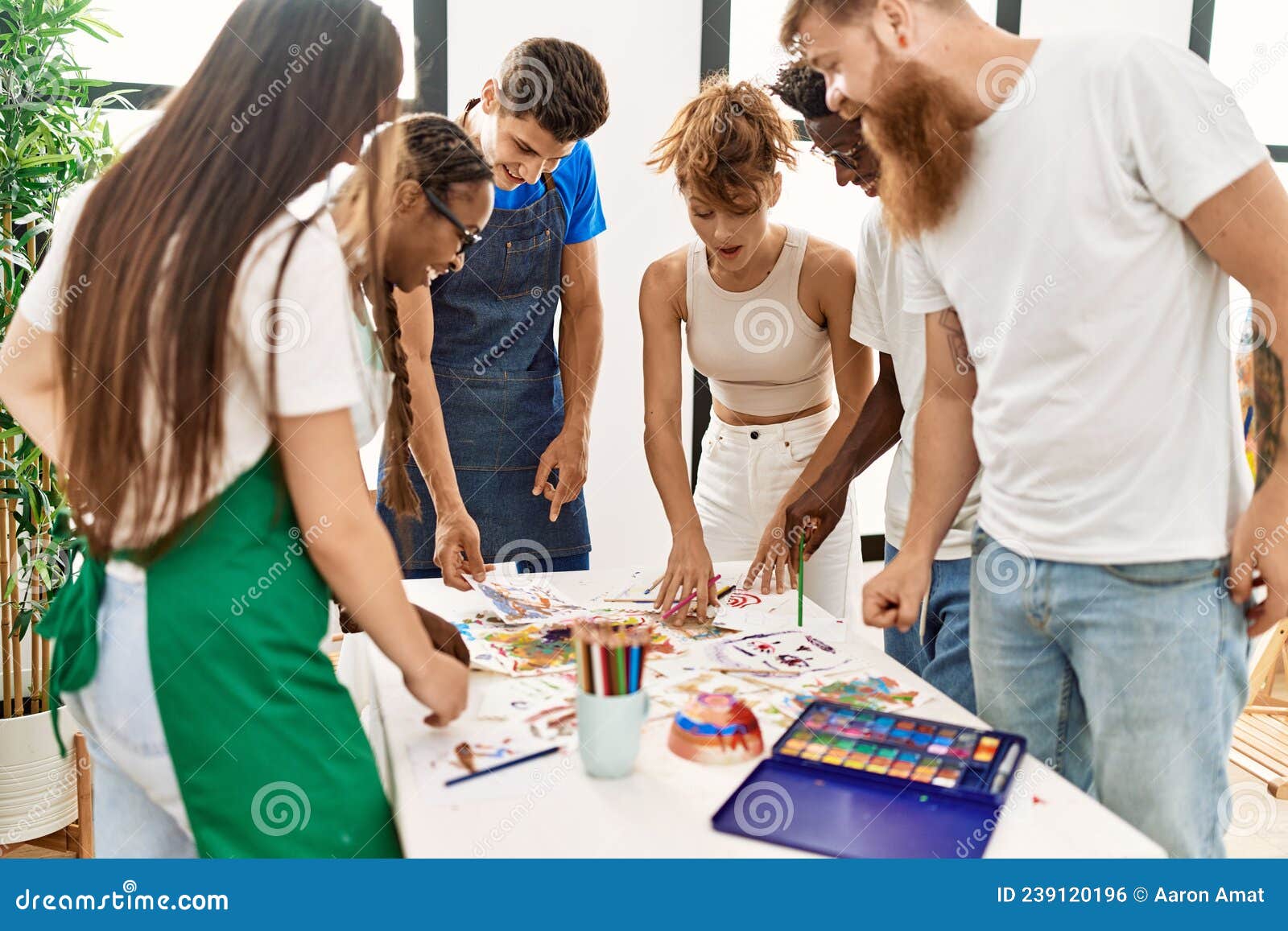 Group of People Smiling Happy Drawing Standing Around the Table at Art ...