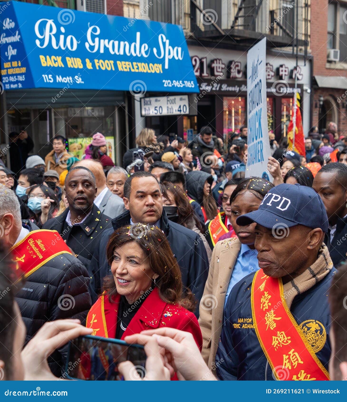 Group of People Standing on a Busy Street Corner, with a Multitude of ...