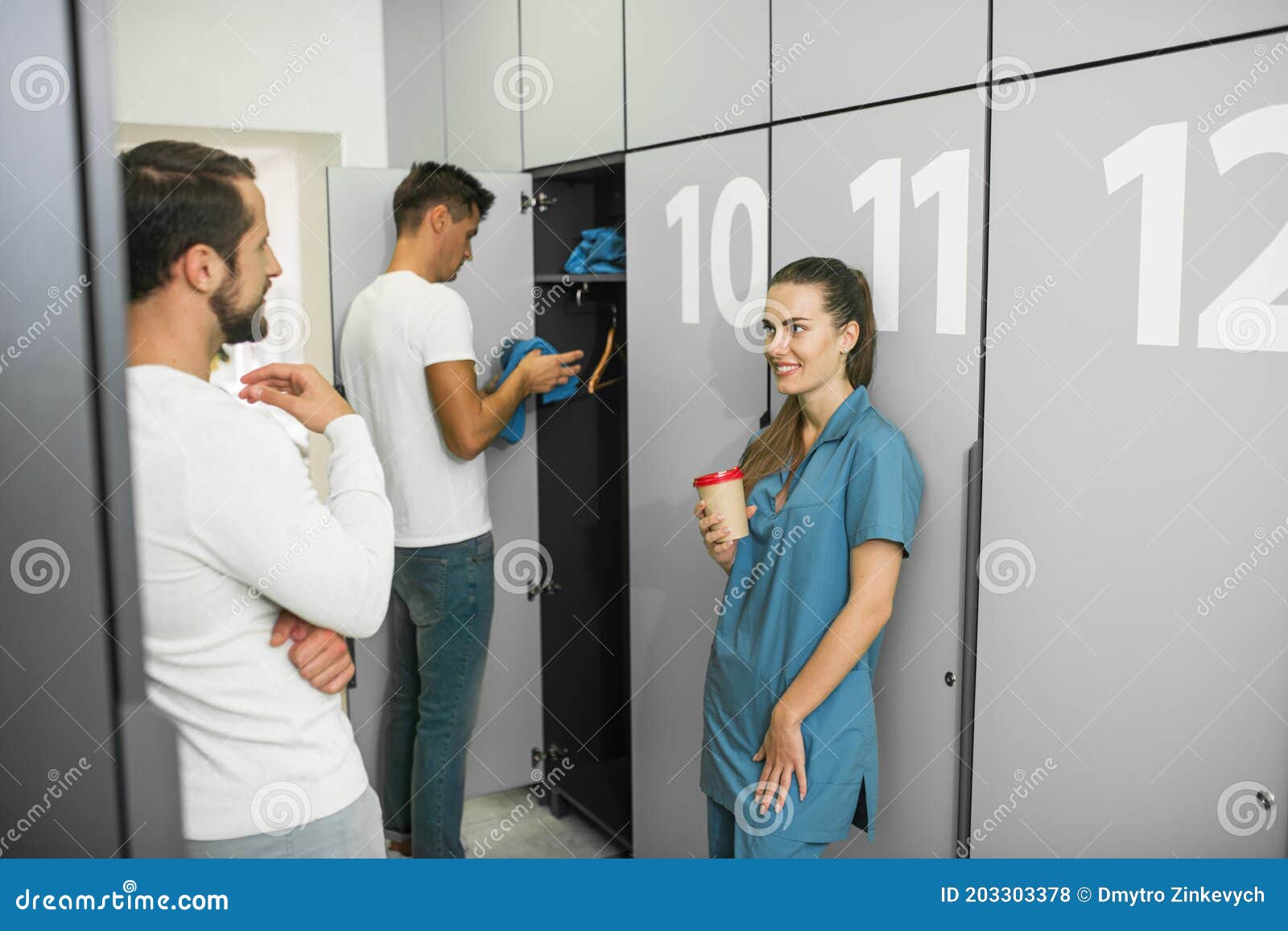 Group of People Standing in the Changing Room Stock Photo - Image of ...
