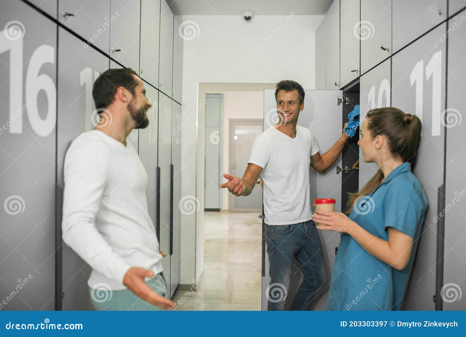 Group of People Standing in the Changing Room and Talking Stock Image ...