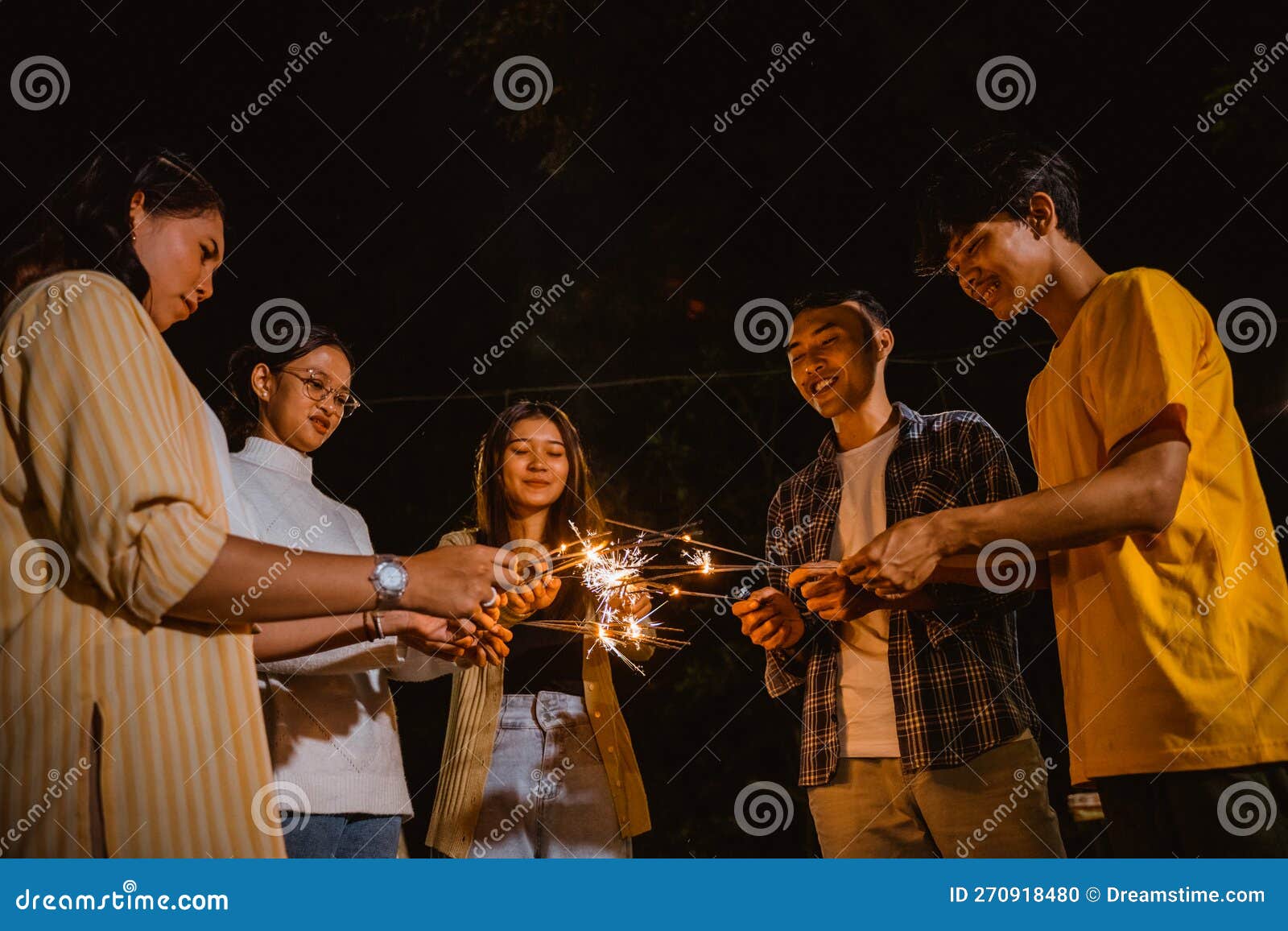 A Group of People Standing in Circle while Playing with the Fireworks ...