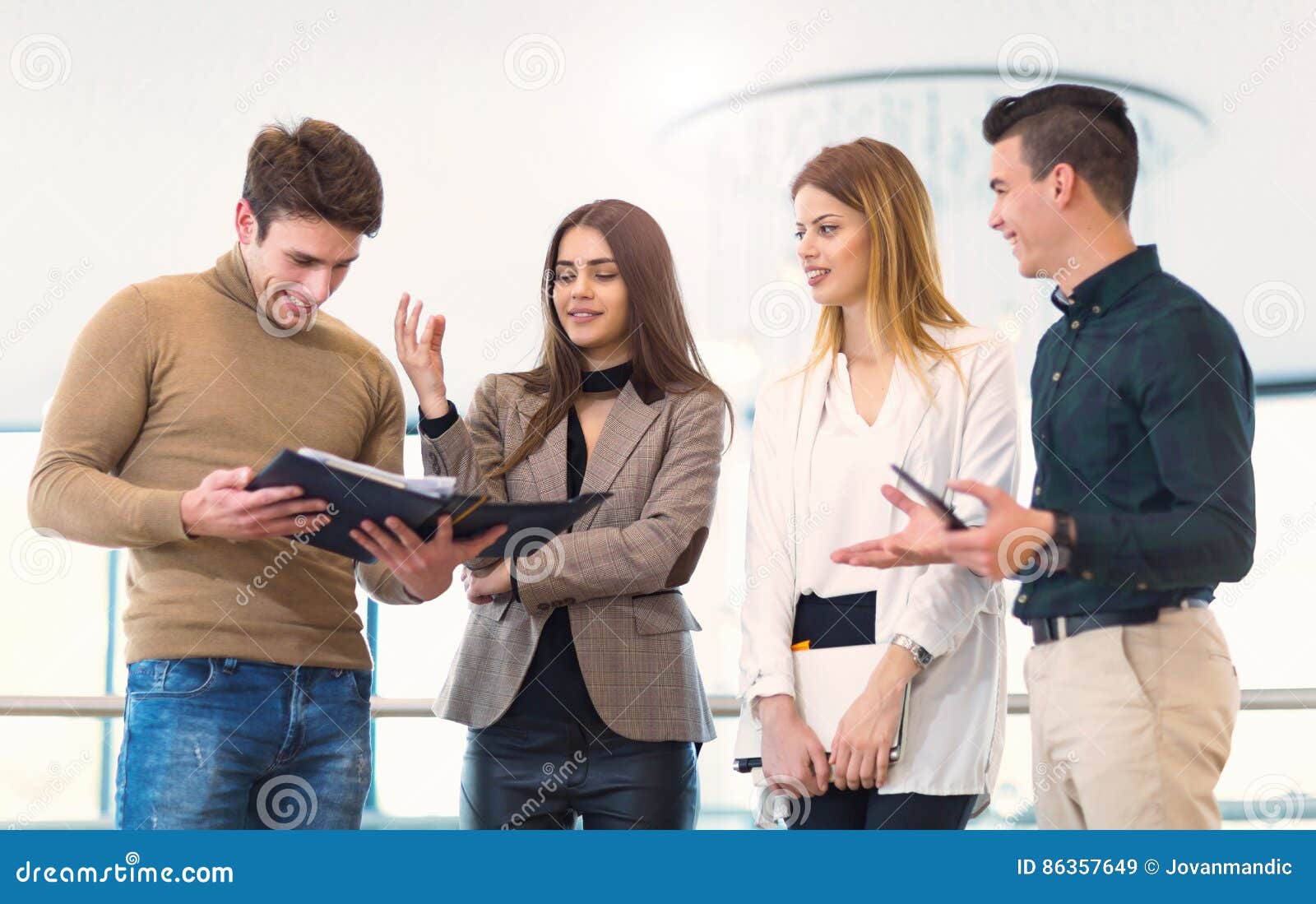 Group of People Standing Close To Each Other while and Gesturing Stock ...