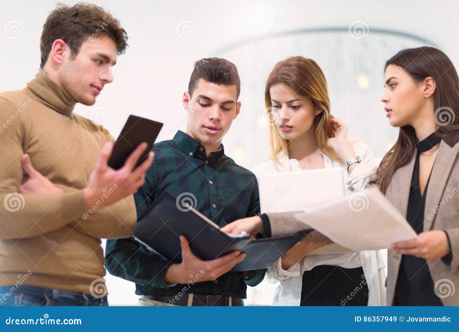 Group of People Standing Close To Each Other while and Gesturing Stock ...