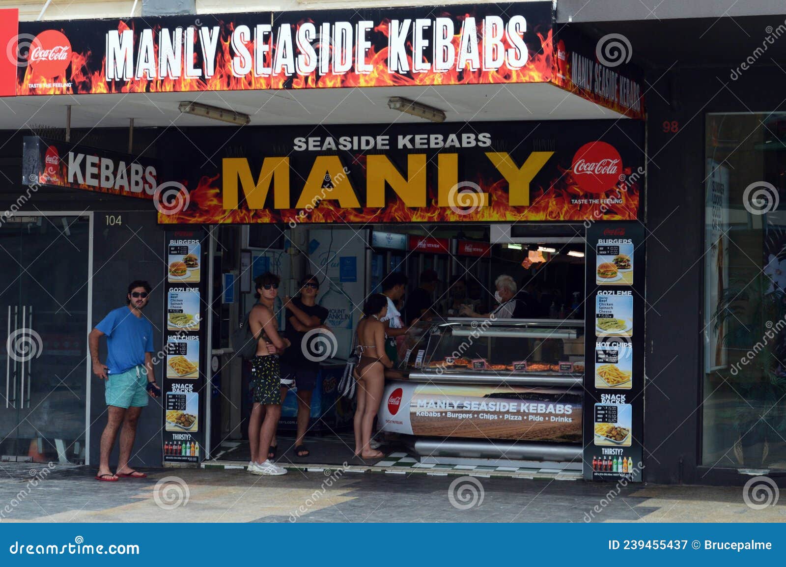 A Group of People Standing in Front of a Kebab Shop in Manly Editorial ...