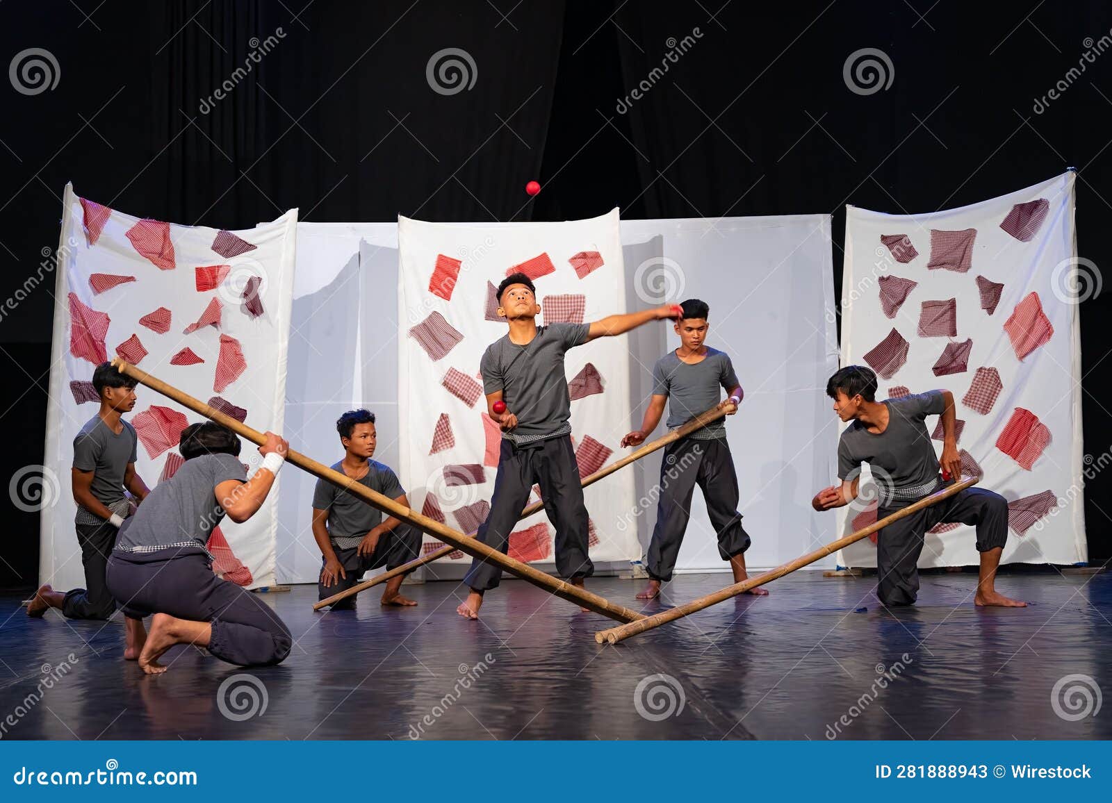 Group of People Standing on an Illuminated Stage during a Performance ...