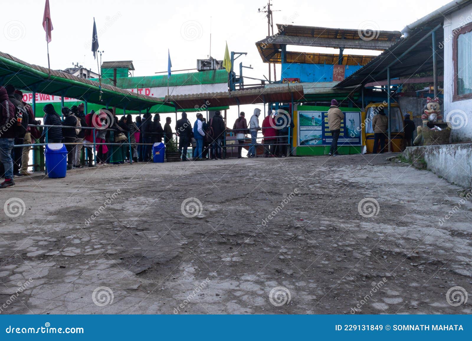 A Group of People Standing in Line for Travelling on Rope Way Service ...