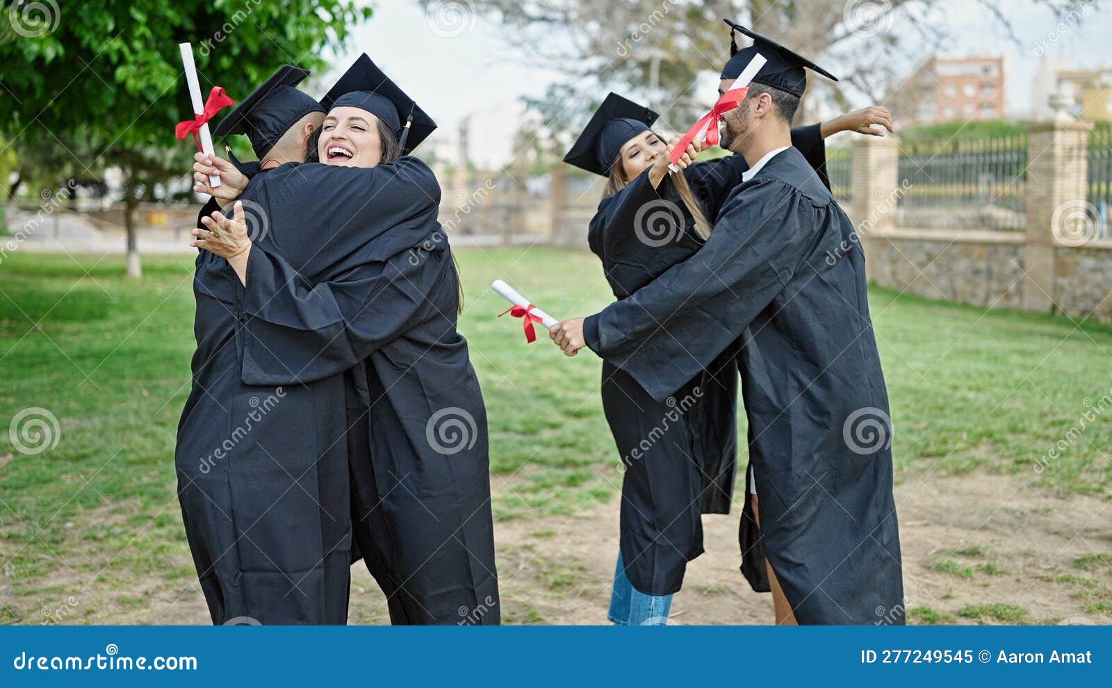 Group of People Students Graduated Holding Diploma Hugging Each Other ...