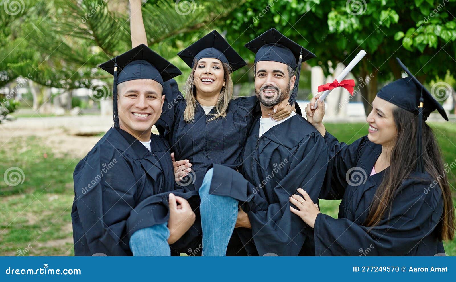 Group of People Students Graduated Holding Diploma Hugging Each Other ...