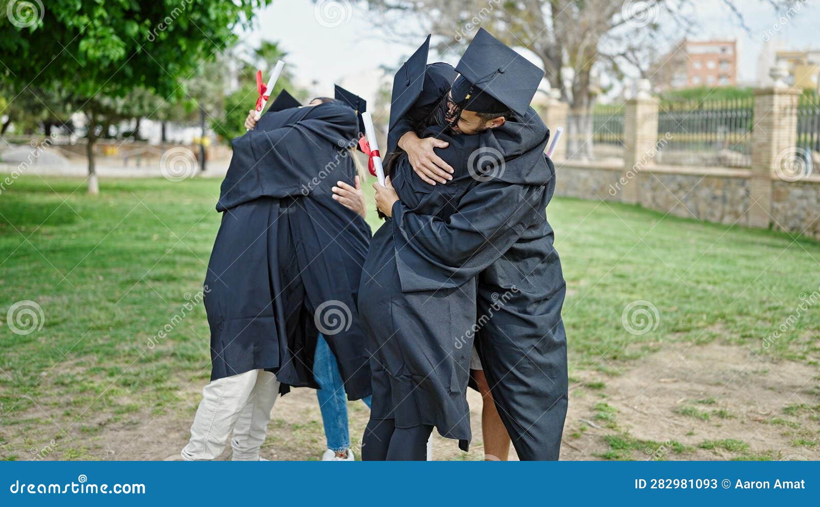 Group of People Students Graduated Holding Diploma Hugging Each Other ...