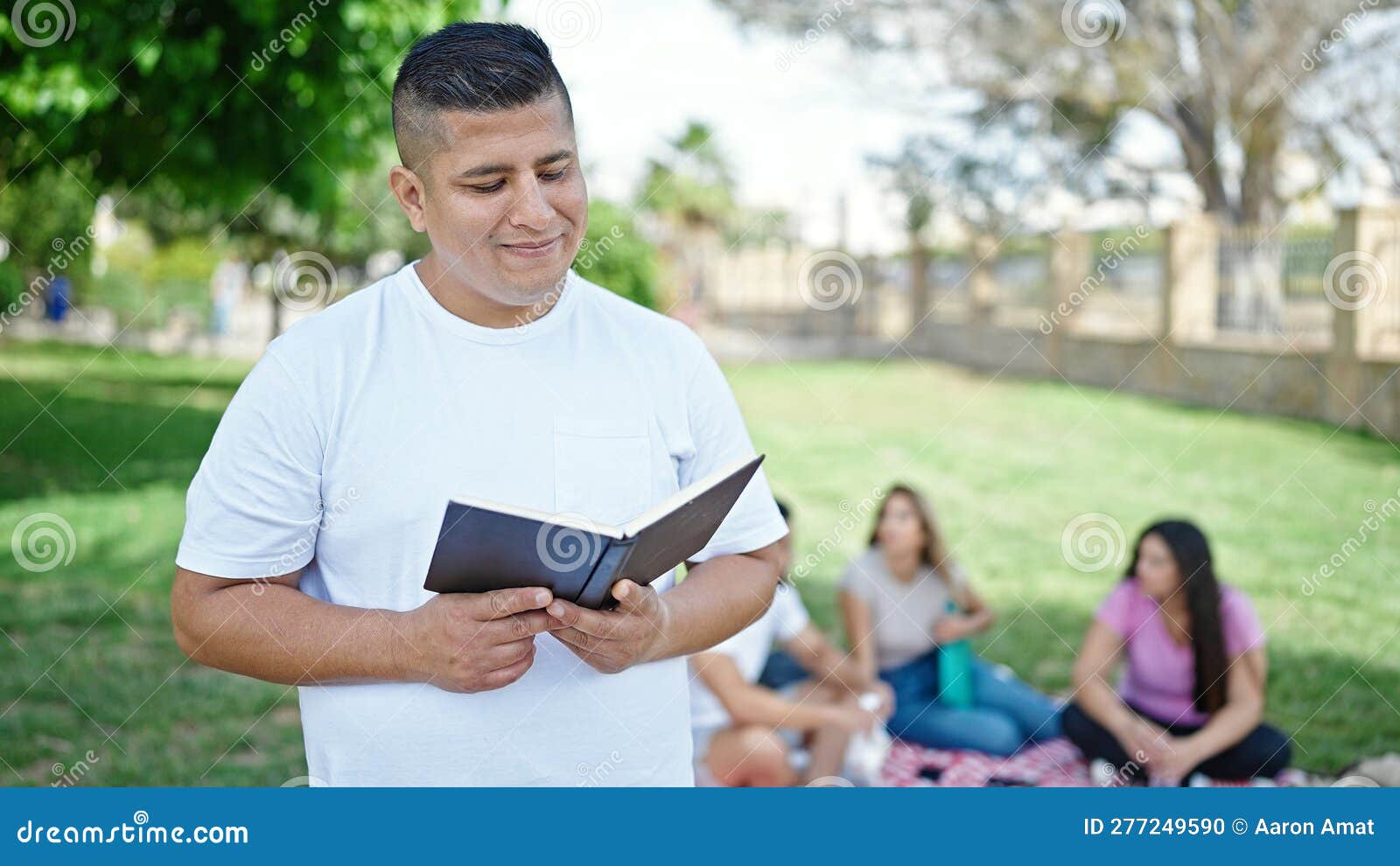 Group of People Students Reciting Book Standing at Park Stock Photo ...