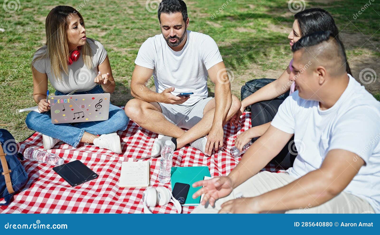 Group of People Students Using Laptop and Smartphone Studying at Park ...