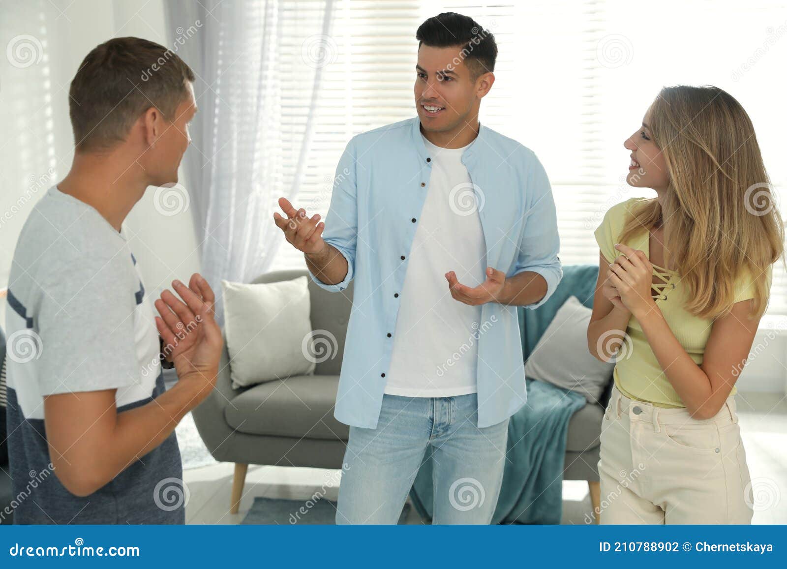 Group of People Talking in Living Room Stock Photo - Image of ...