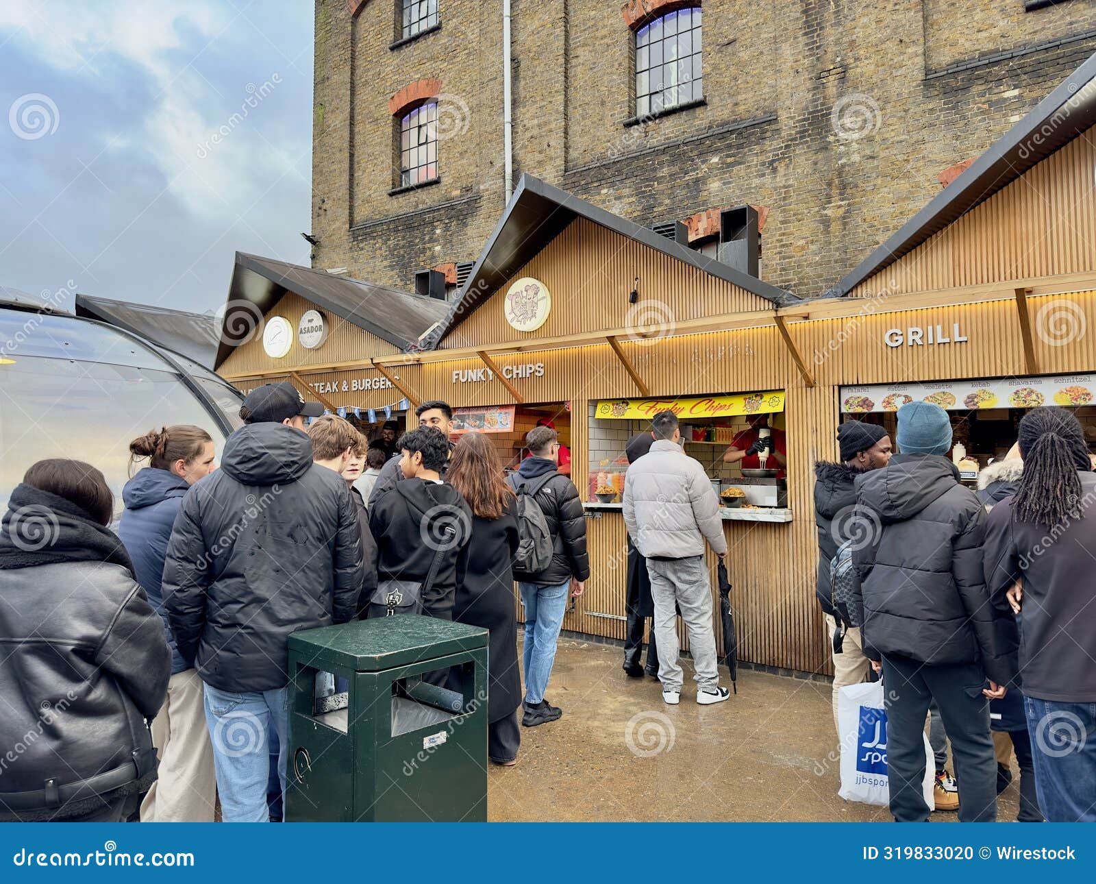 A Crowd of People Standing in Line at a Food Stand Editorial Image ...