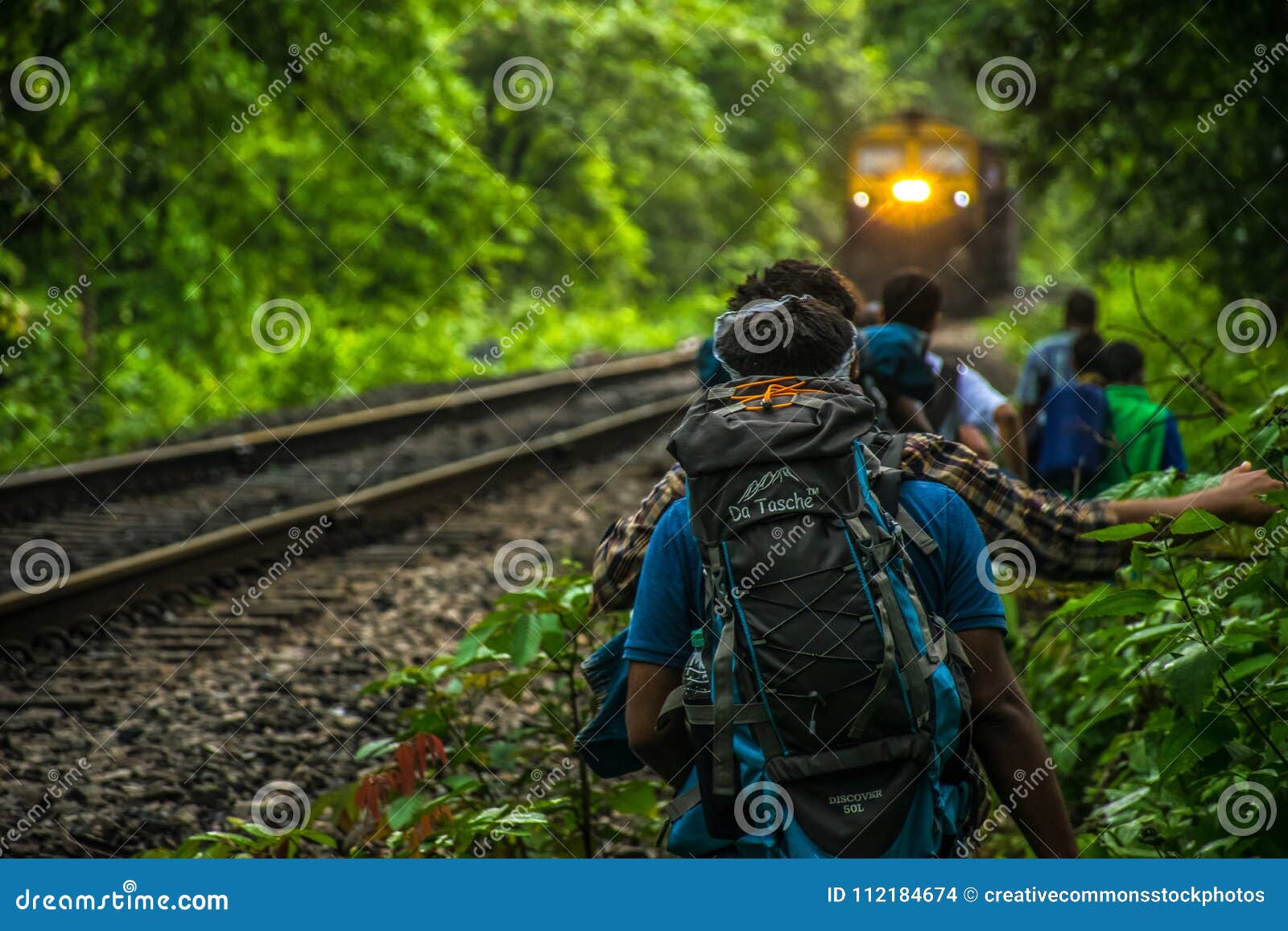 Group Of People Walking Beside Train Rail Picture. Image: 112184674