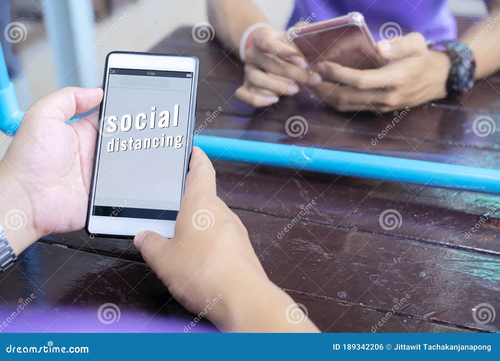 A Group of People Who are Using a Smartphone Stock Photo - Image of ...