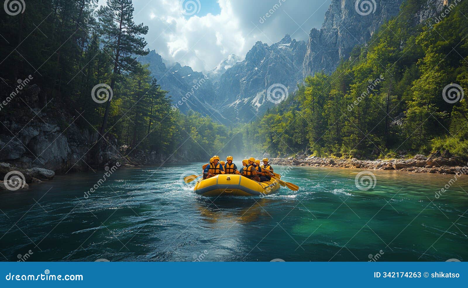 Group of People in a Yellow Raft on a River in a Valley with High ...