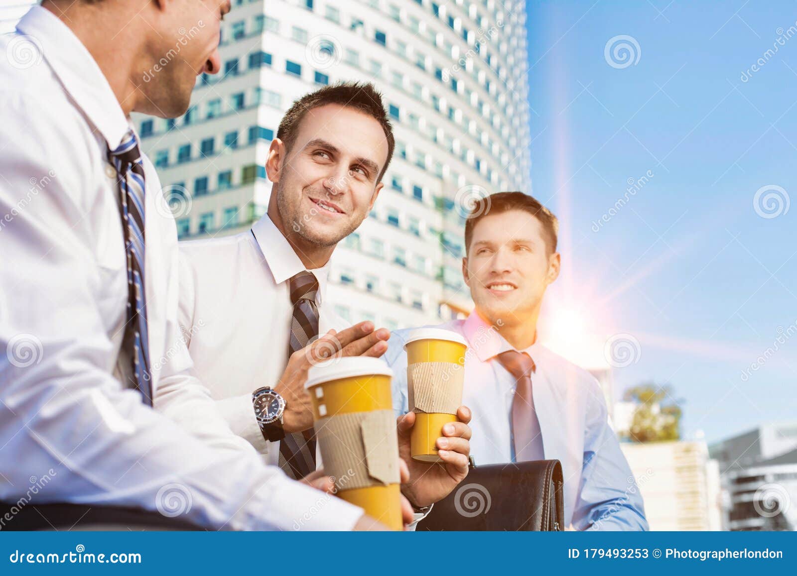 Group of Colleagues Sitting and Talking while Drinking Coffee after ...