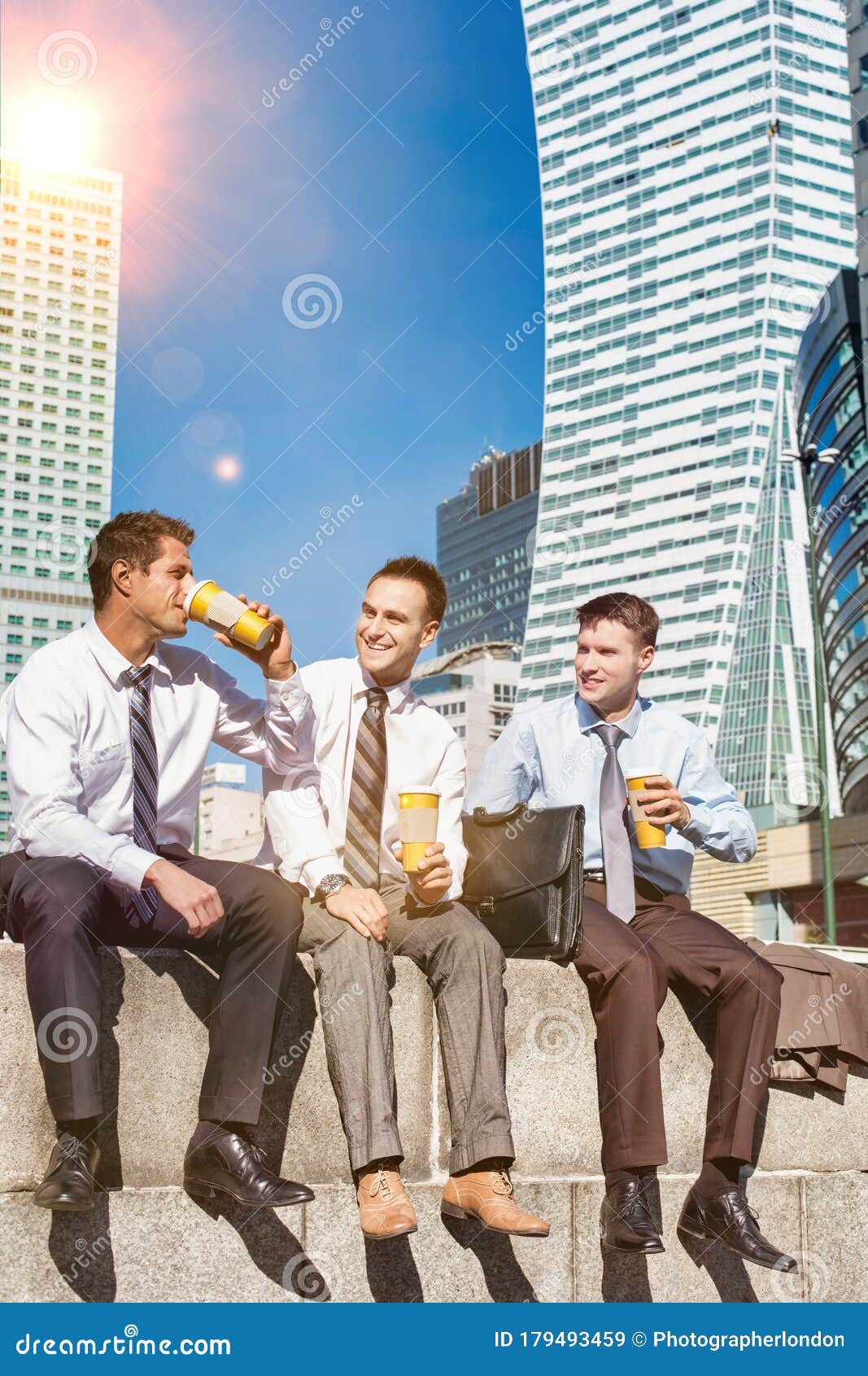 Group of Colleagues Sitting and Talking while Drinking Coffee after ...