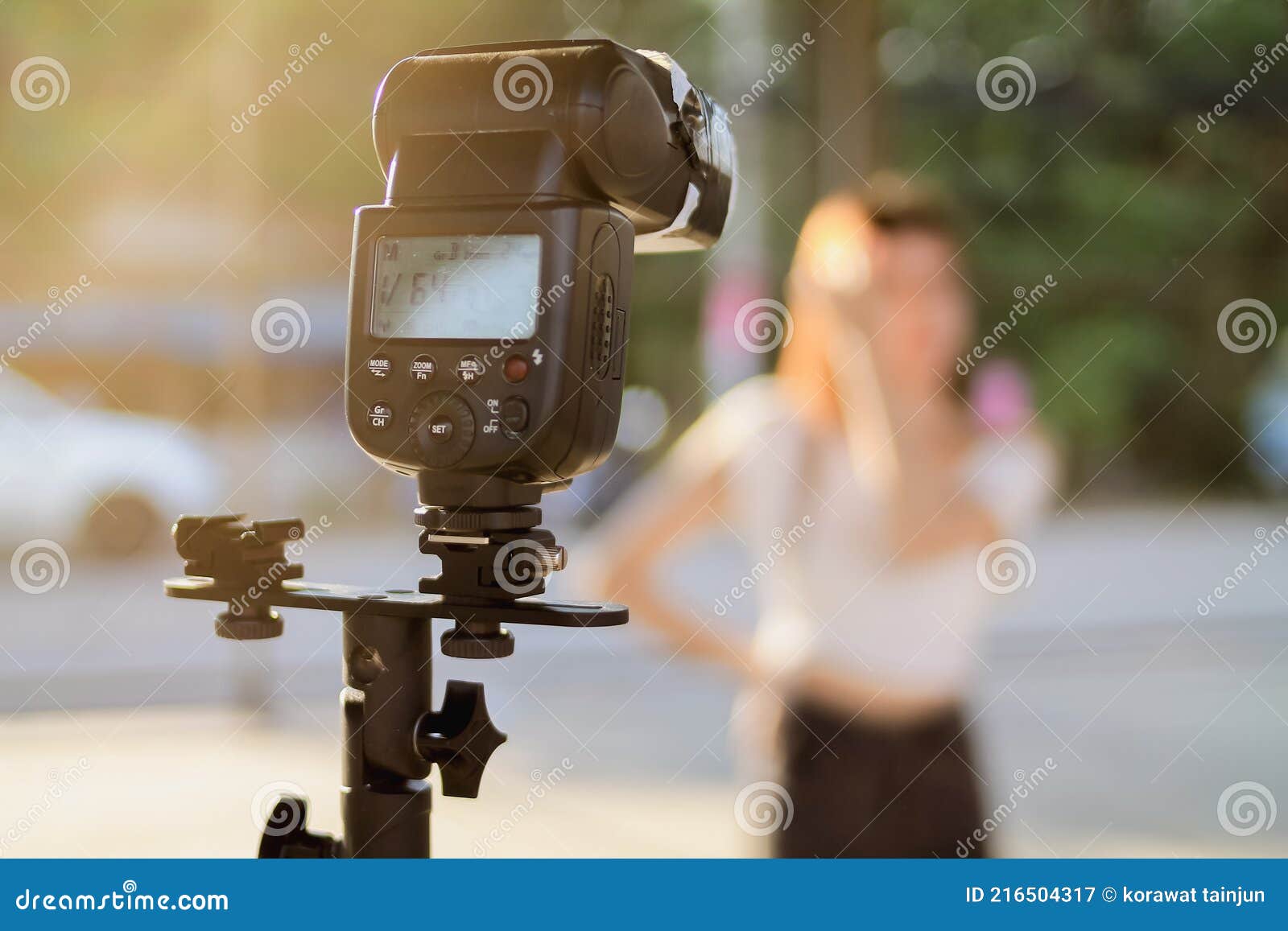 A Group of Photographers is Recording the Model Using a Separate Flash ...
