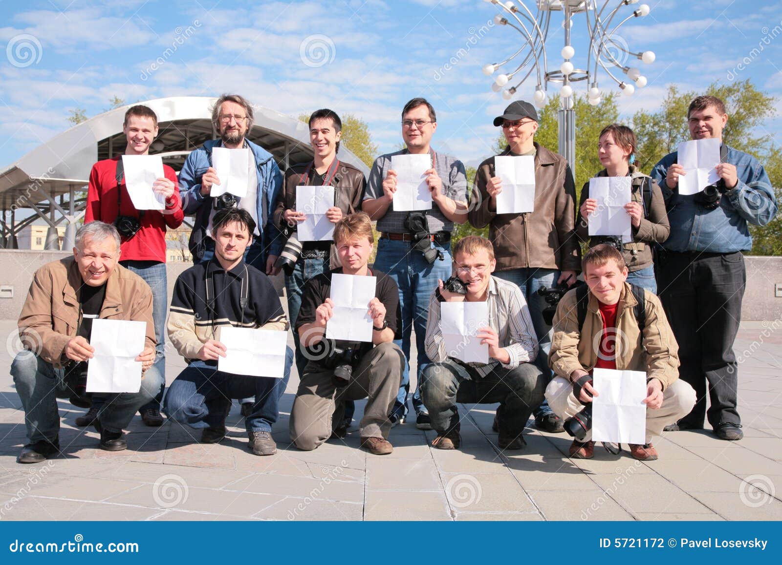 Group of Photographers with Sheets of Paper Stock Photo - Image of ...