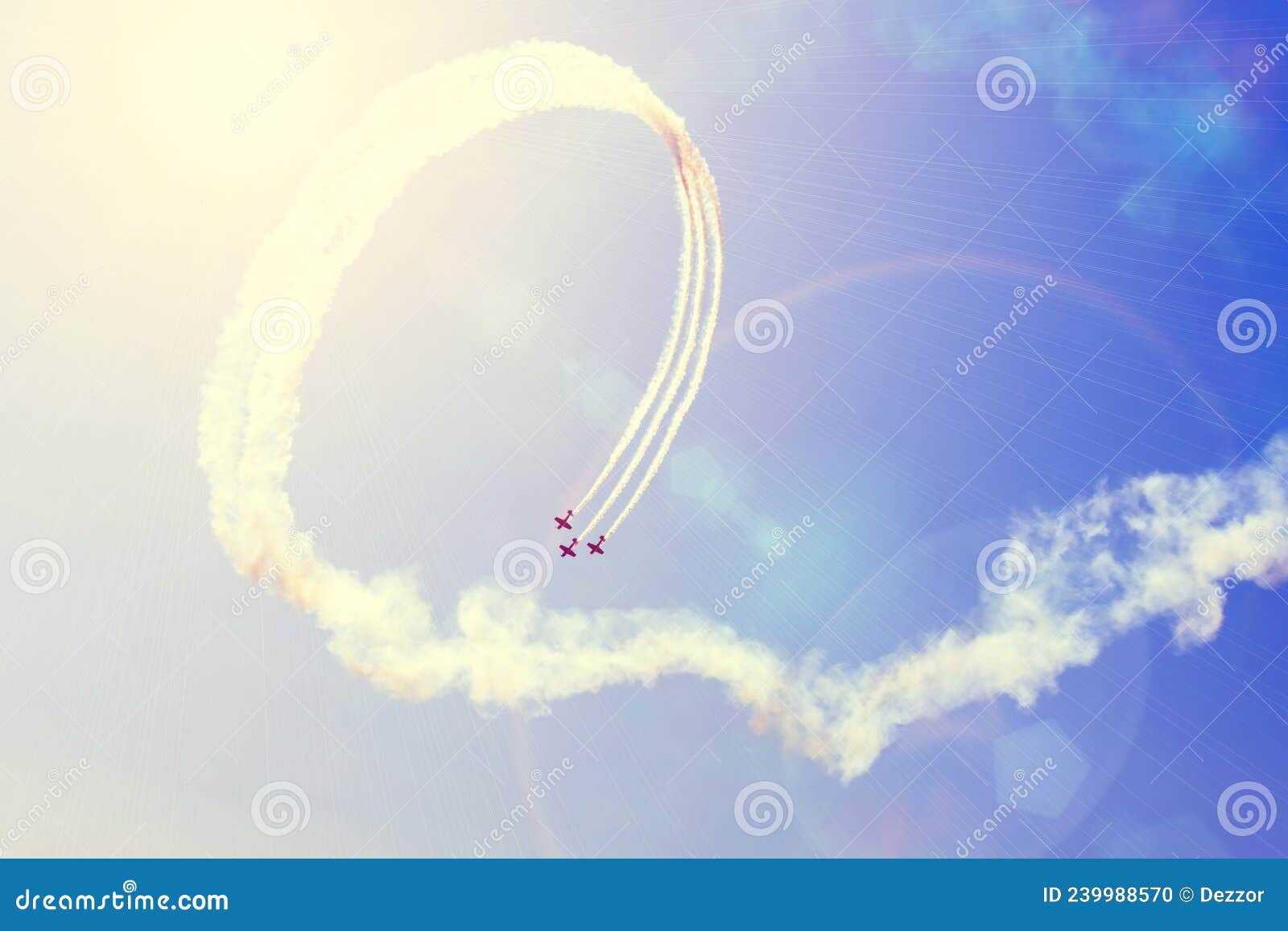 A Group of Planes Perform a Dead Loop Leaving a Smoky Trail in the Rays ...
