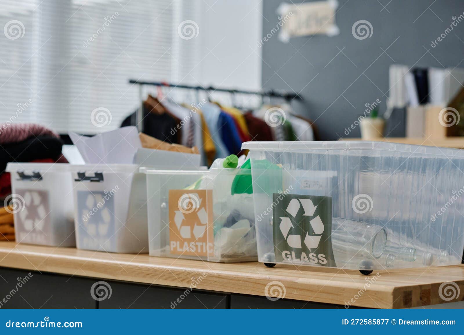 Group of Plastic Containers for Separate Litter Standing on Desk Stock ...