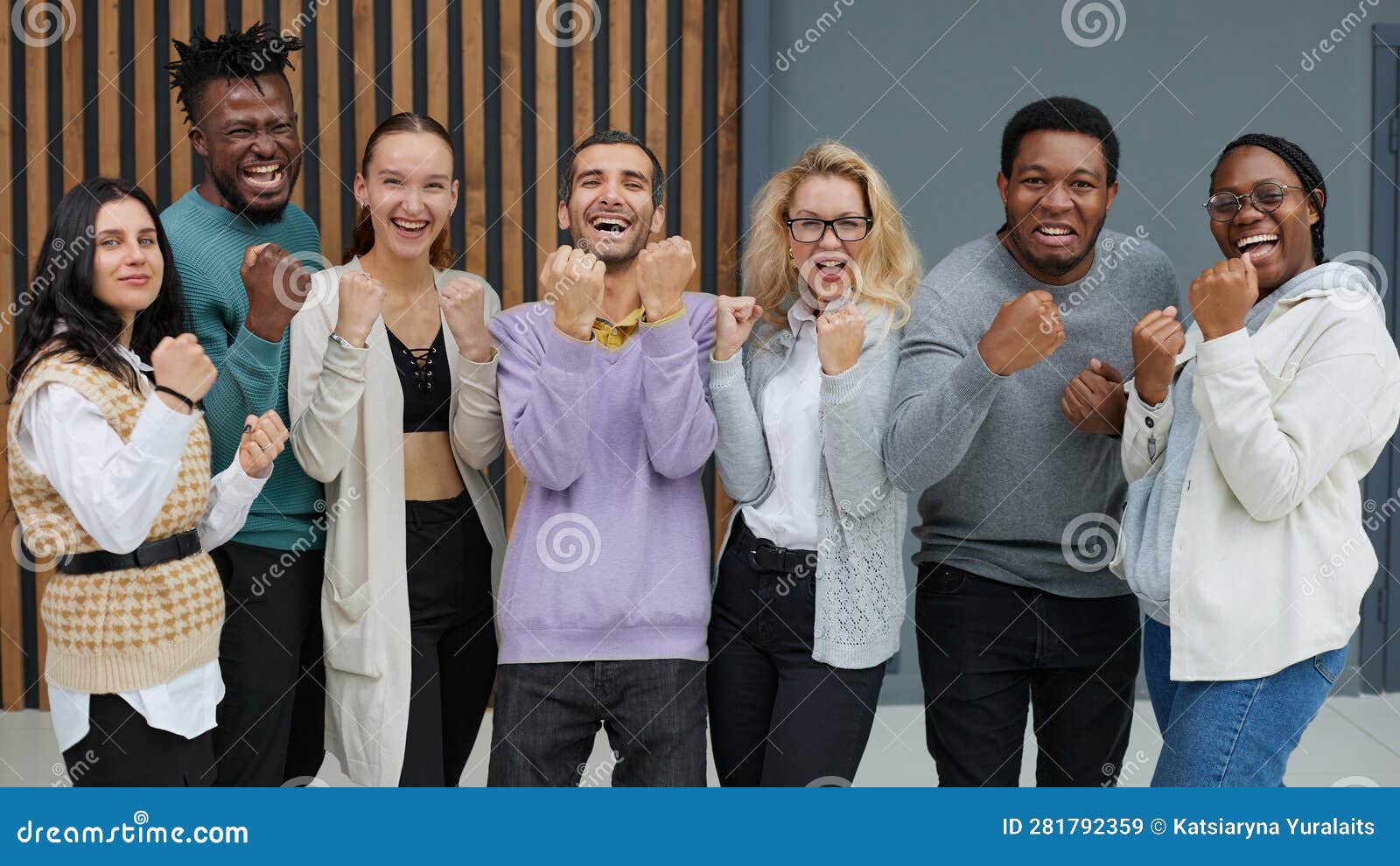 Group of Business Workers Smiling Happy. Standing with Fists Up at the ... Group of Business Workers Smiling Happy. Standing with Fists Up at the ...