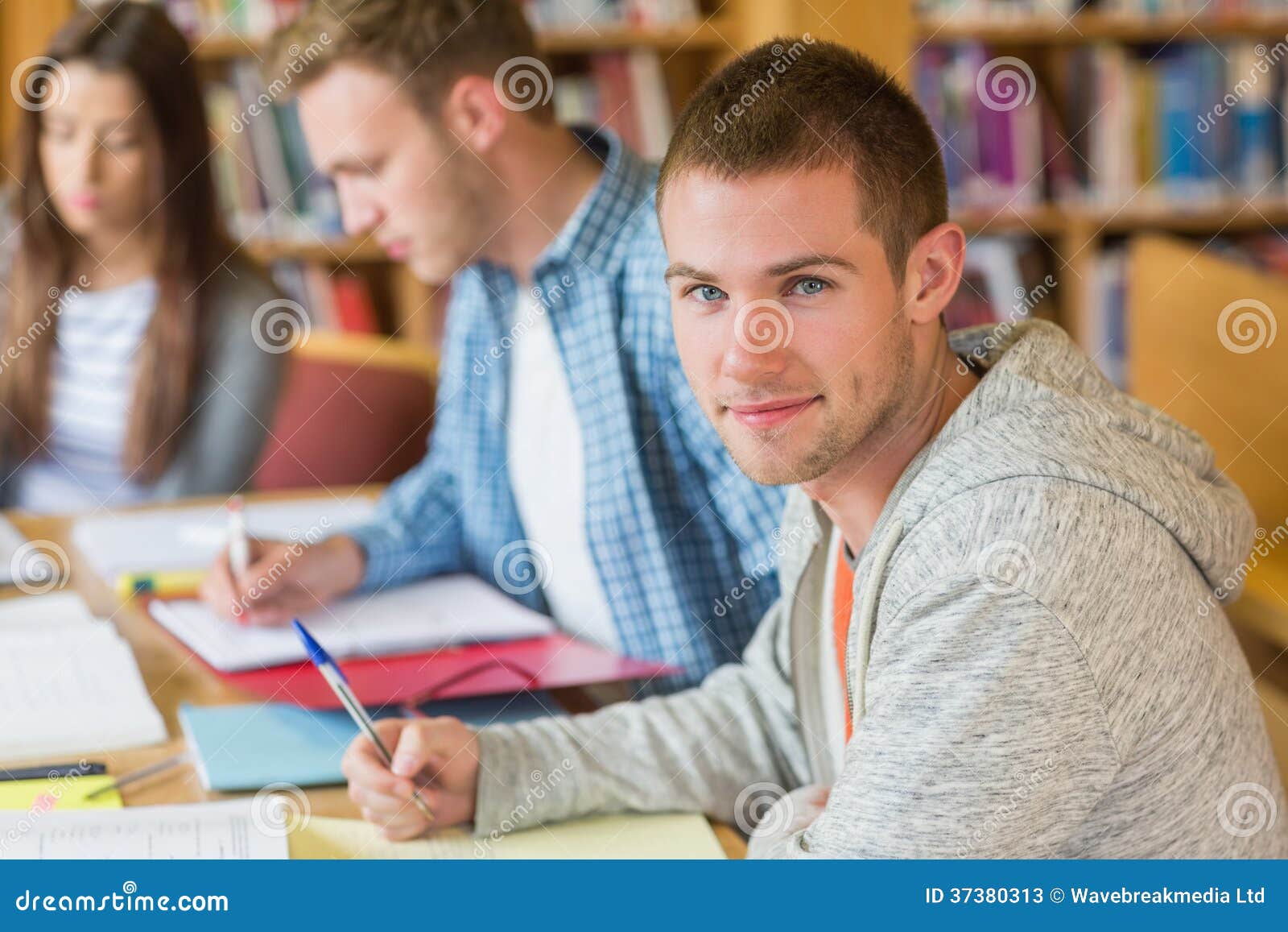 Students Writing Notes at Library Desk Stock Image - Image of studying ...
