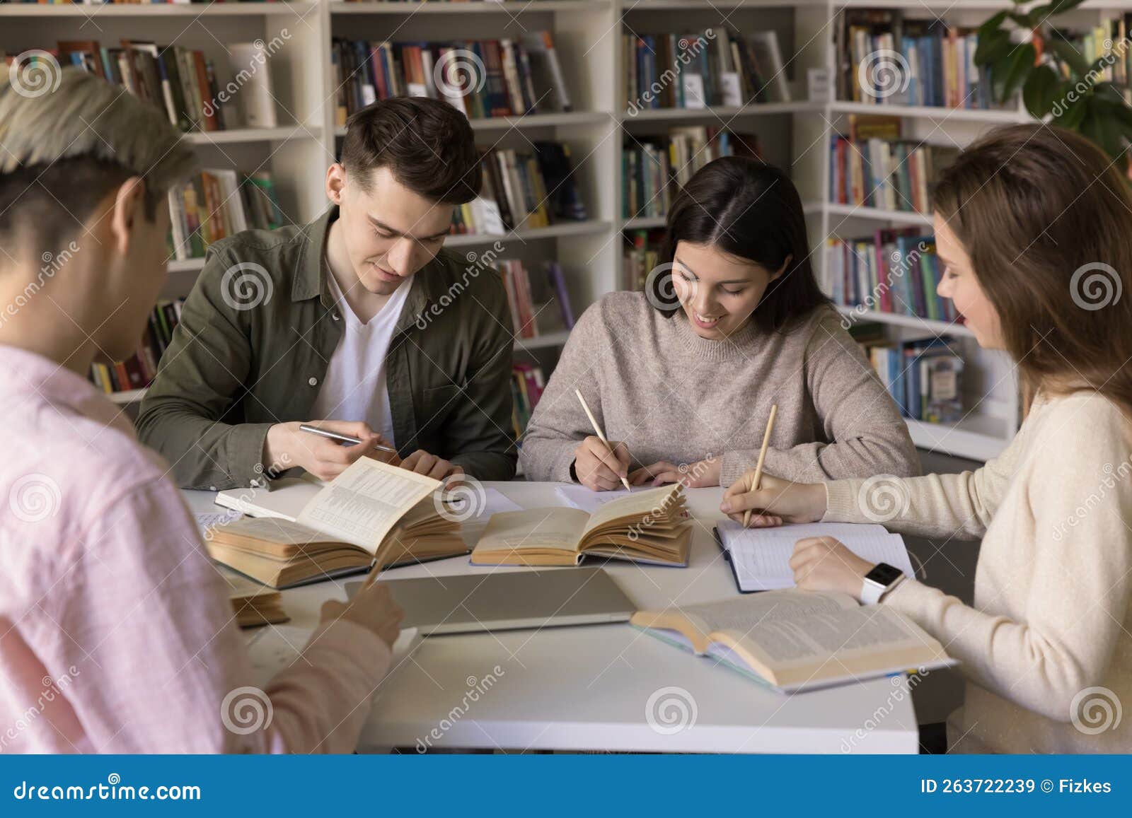 Group of Positive Young Hardworking Smart Students Studying in Library ...