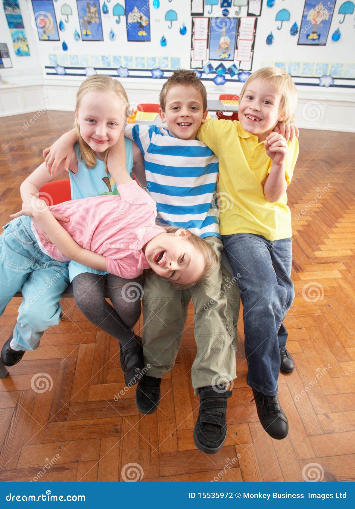 Group of Primary Schoolchildren in Classroom Stock Photo - Image of ...