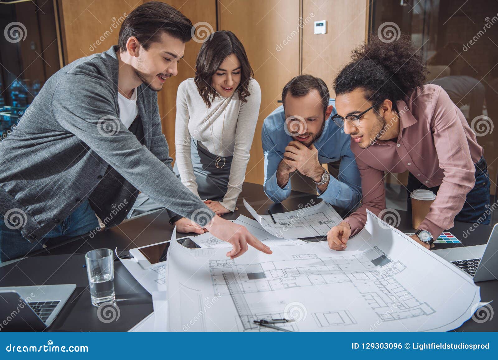 Group of Professional Architects Discussing Building Plans Stock Photo ...