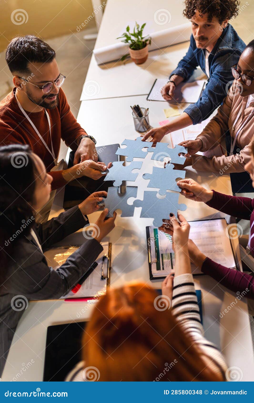 Group of Professional People Playing Puzzle in the Office Stock Photo ...