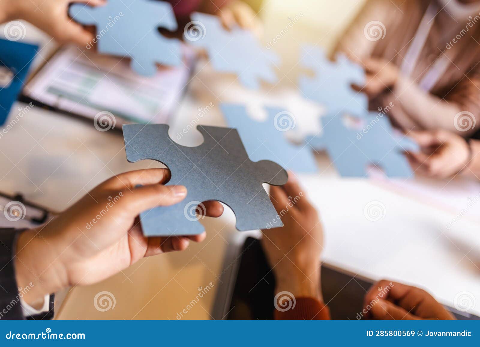 Group of Professional People Playing Puzzle in the Office.Team Building ...