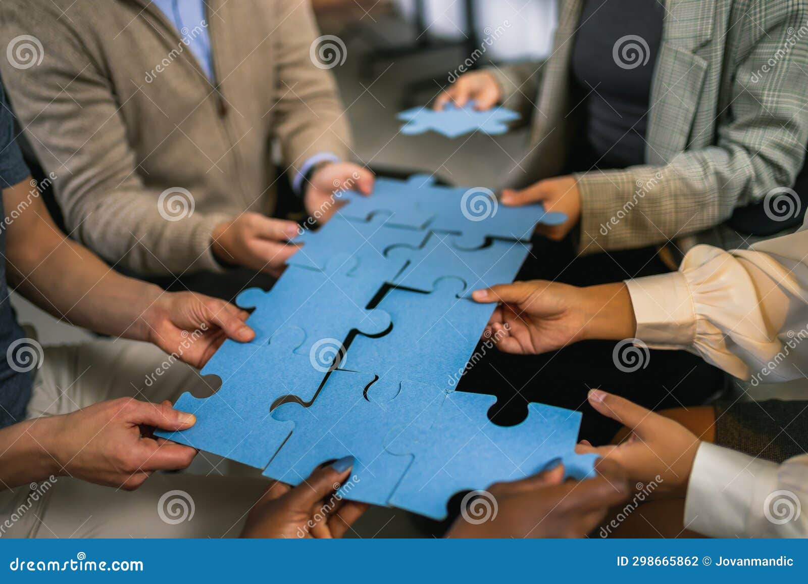 Group of Professional People Playing Puzzle in the Office. Stock Photo ...
