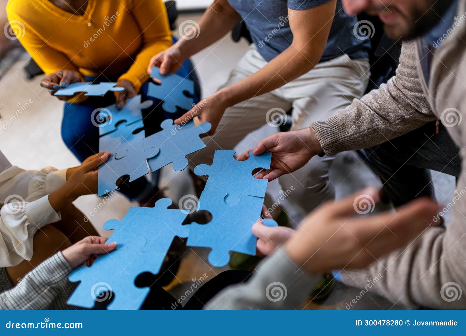 Group of Professional People Playing Puzzle in the Office. Stock Photo ...