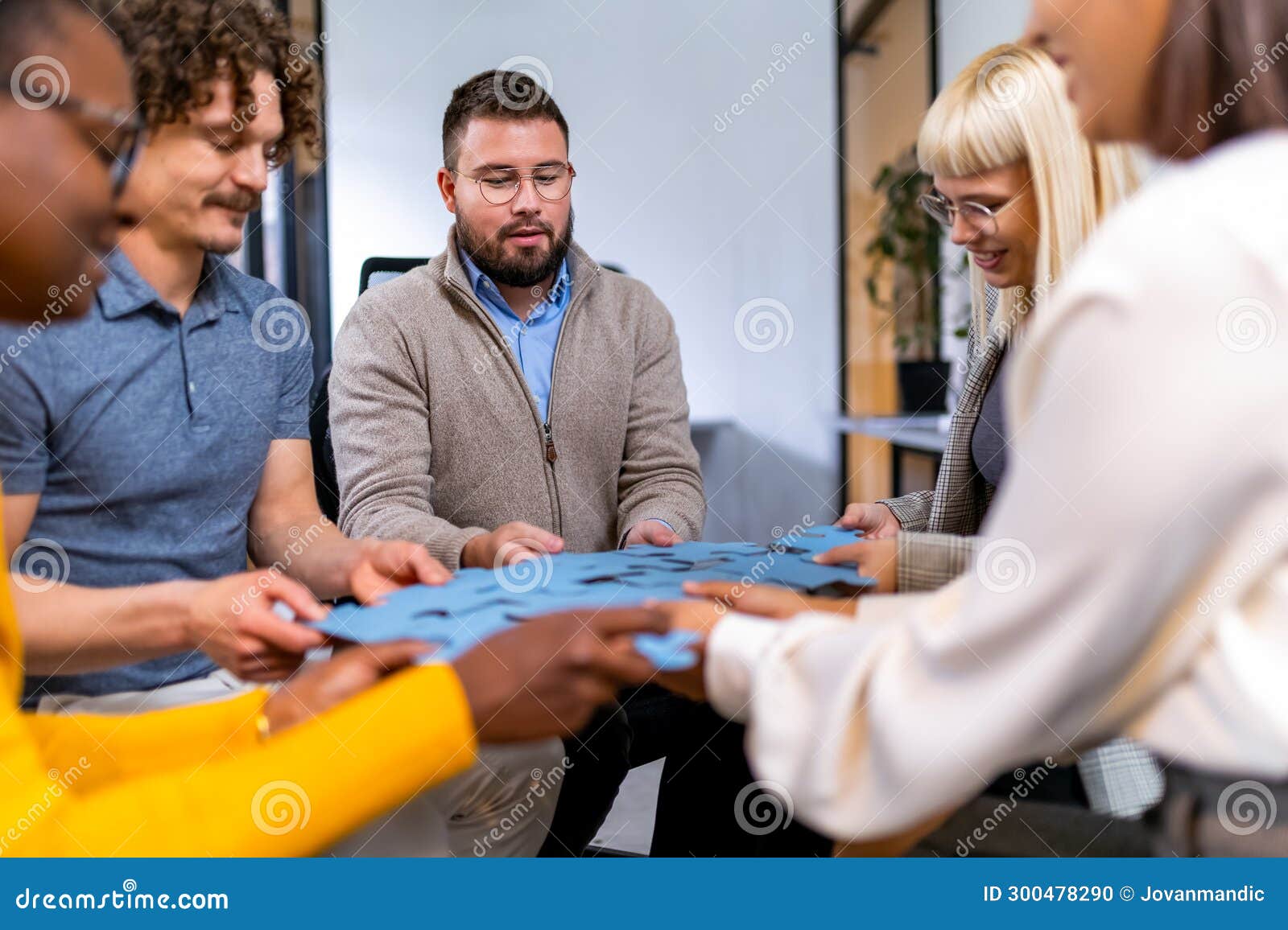 Group of Professional People Playing Puzzle in the Office. Stock Photo ...