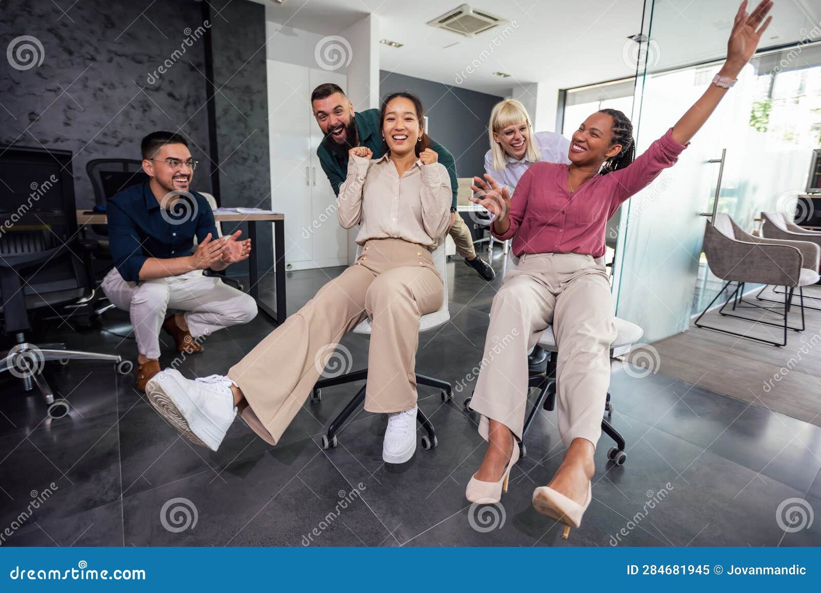 Professional People Racing with the Chairs while on a Break in the ...
