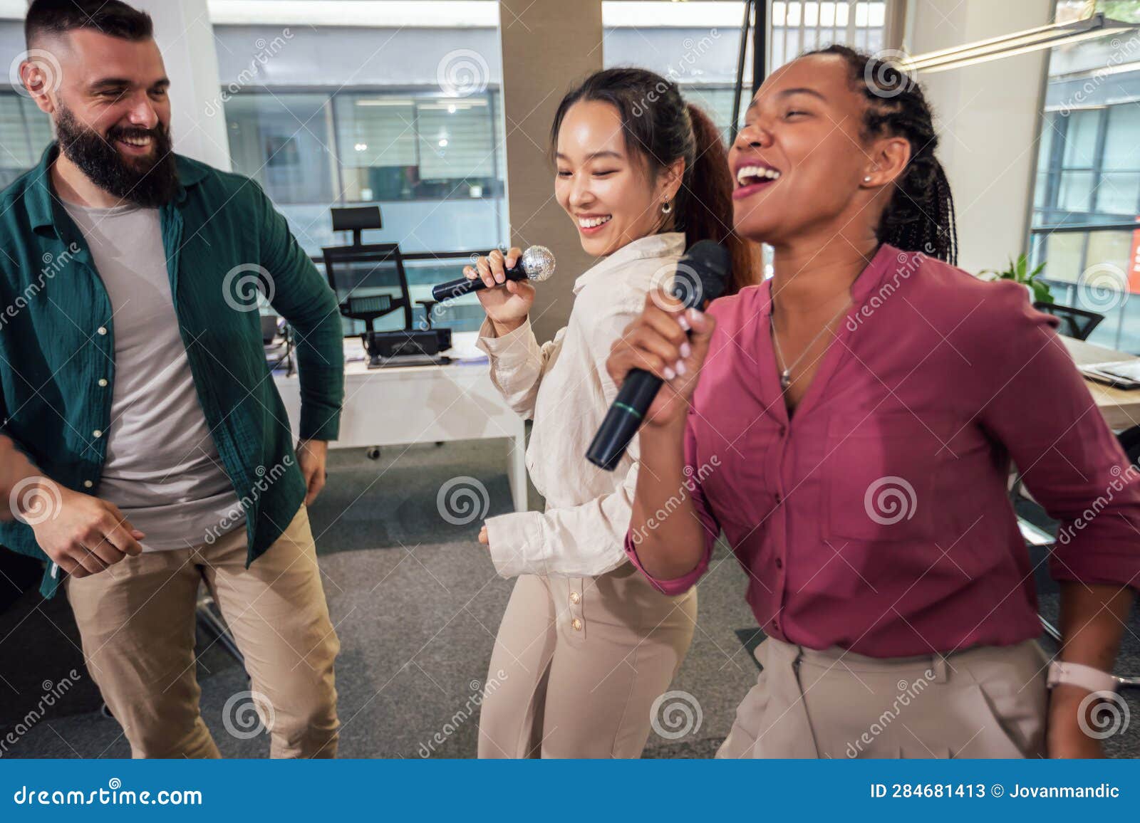 Professional People Singing Karaoke in the Modern Office Stock Image ...