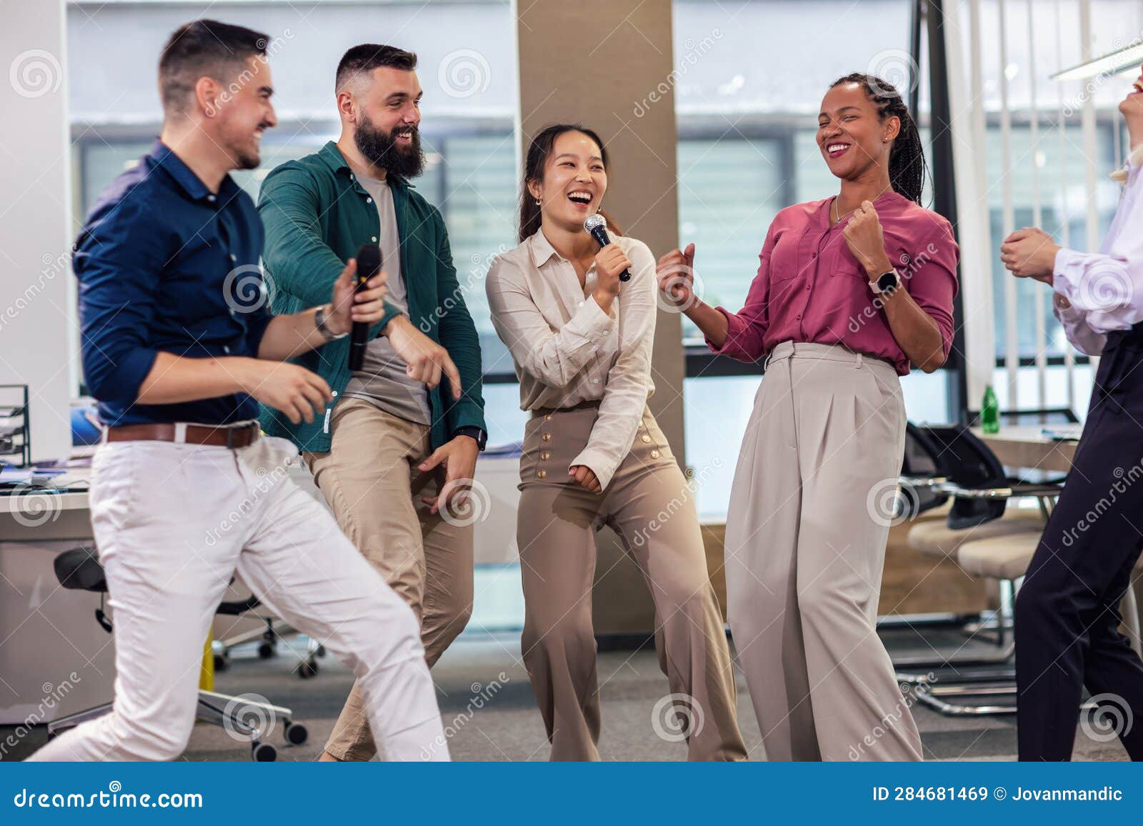 Professional People Singing Karaoke in the Modern Office Stock Image ...