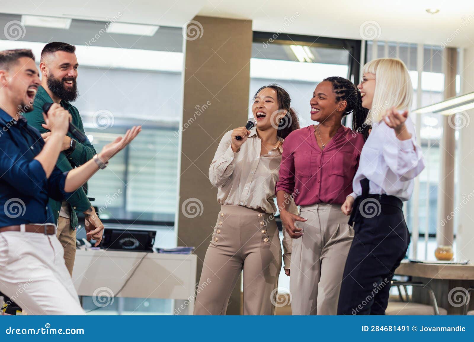 Professional People Singing Karaoke in the Modern Office Stock Image ...