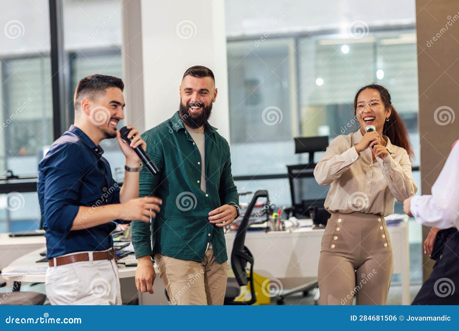 Professional People Singing Karaoke in the Modern Office Stock Photo ...