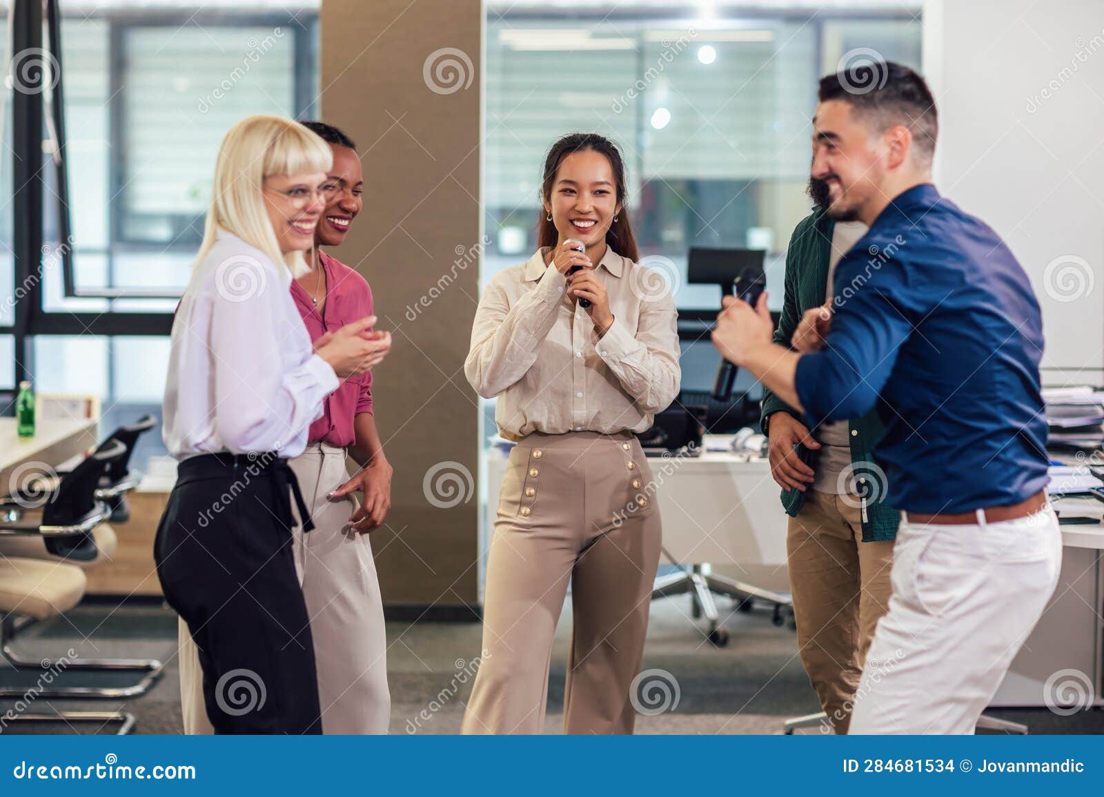 Professional People Singing Karaoke in the Modern Office Stock Photo ...